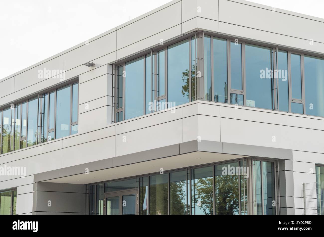 Modern office building with a sleek design and large glass windows that ...