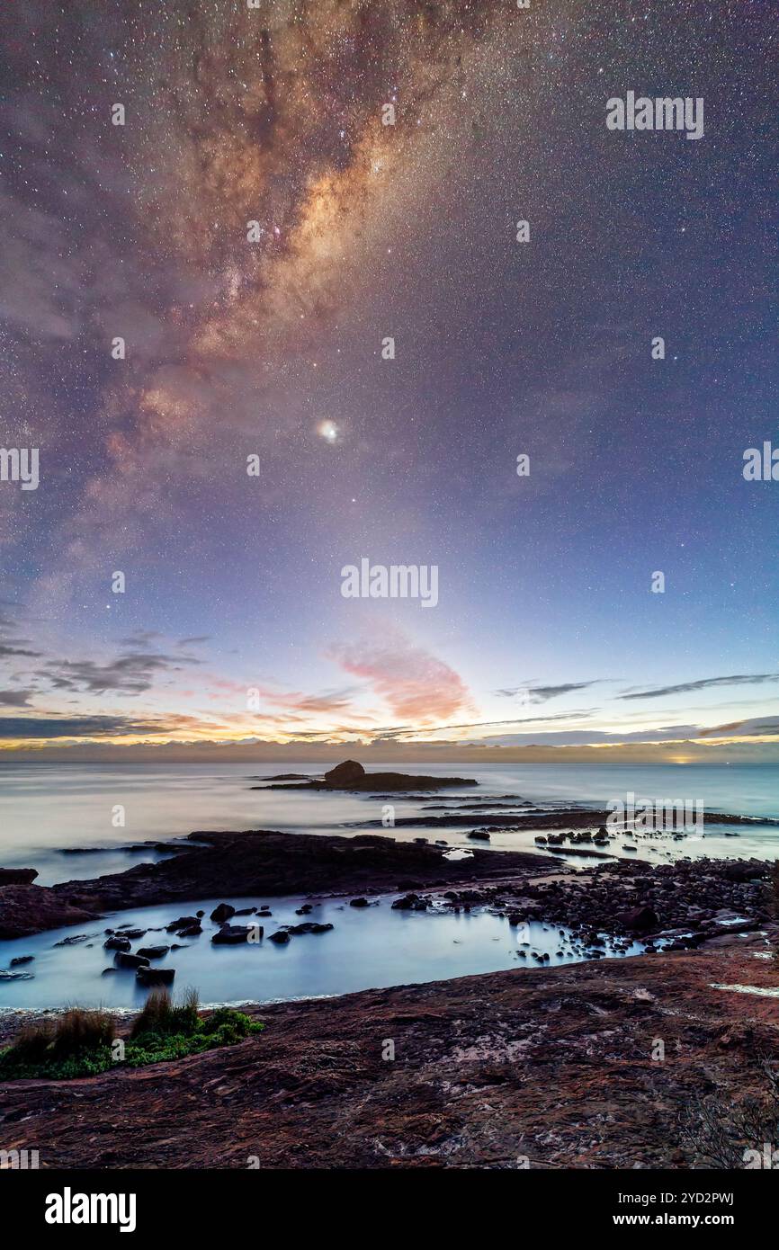 Starry night sky just before sunrise of coastal landscape Stock Photo ...