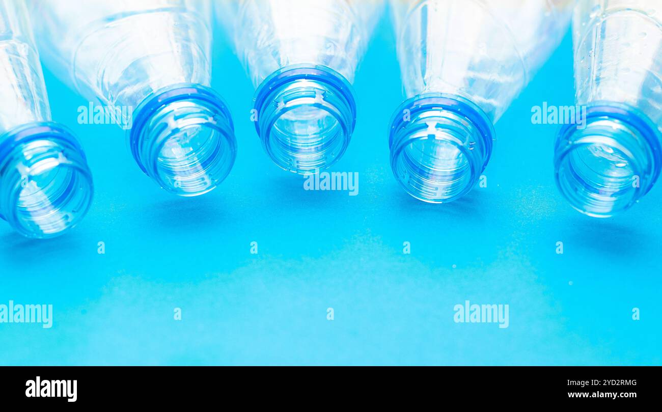 Plastic bottle on a solid blue background. Protect the environment ...