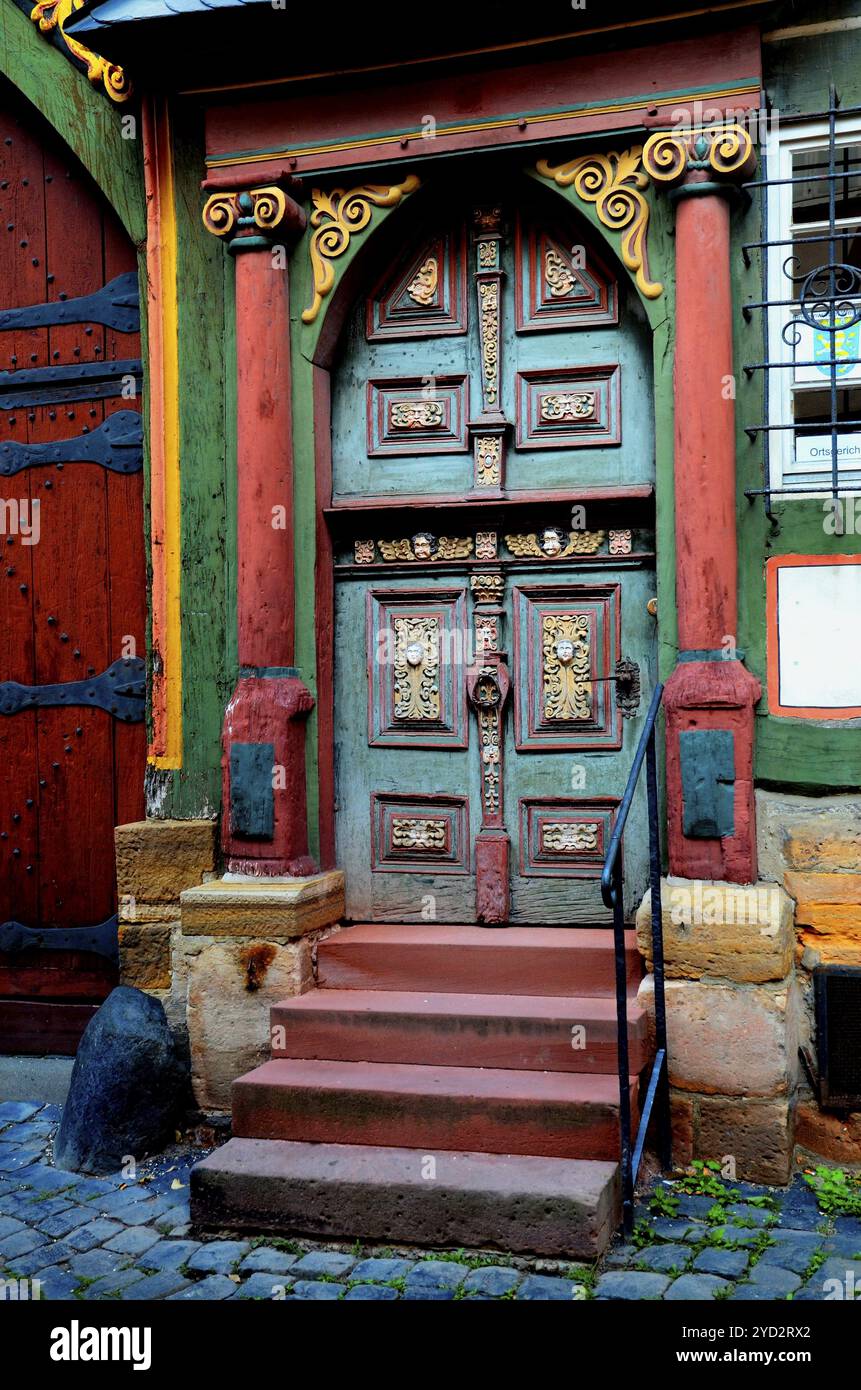 Renaissance door with painted wood carvings in a half-timbered house ...