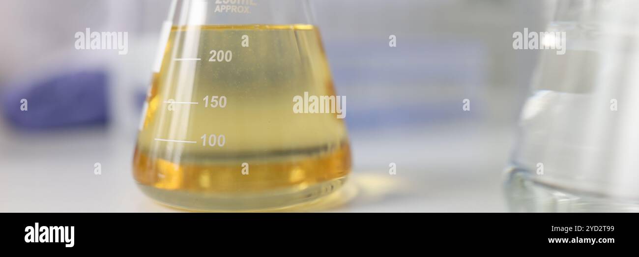 Erlenmeyer flask with yellow liquid in chemical laboratory Stock Photo ...