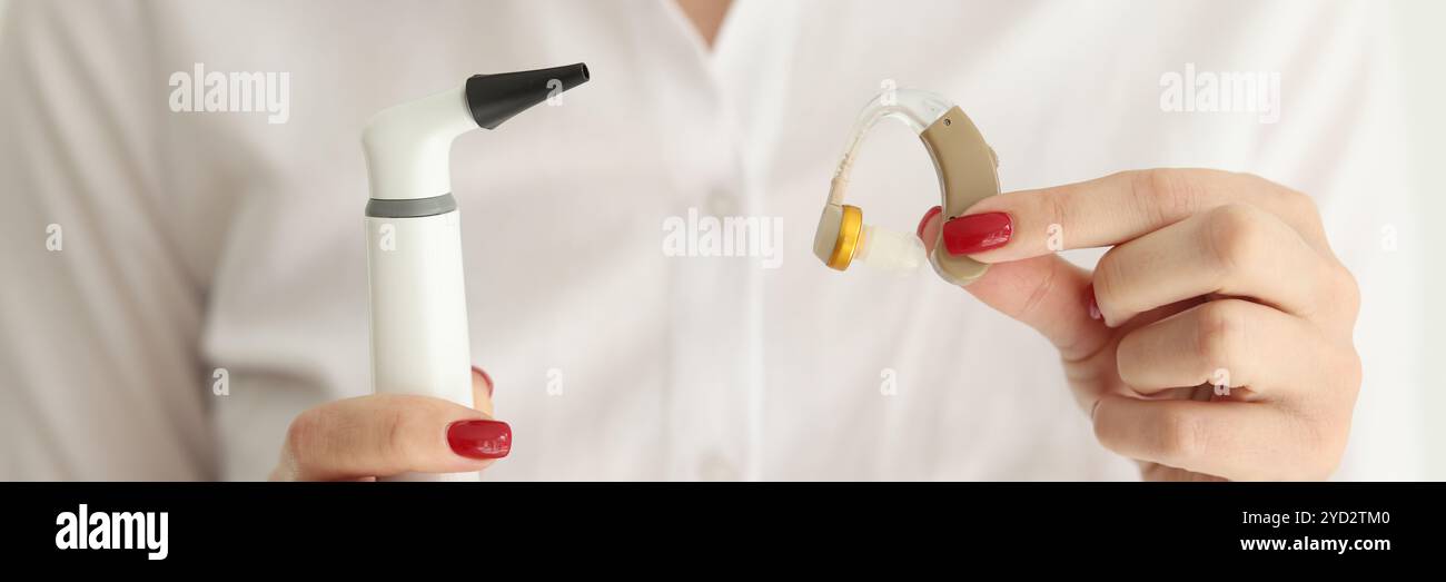 Hearing test woman otoscope hi-res stock photography and images - Alamy