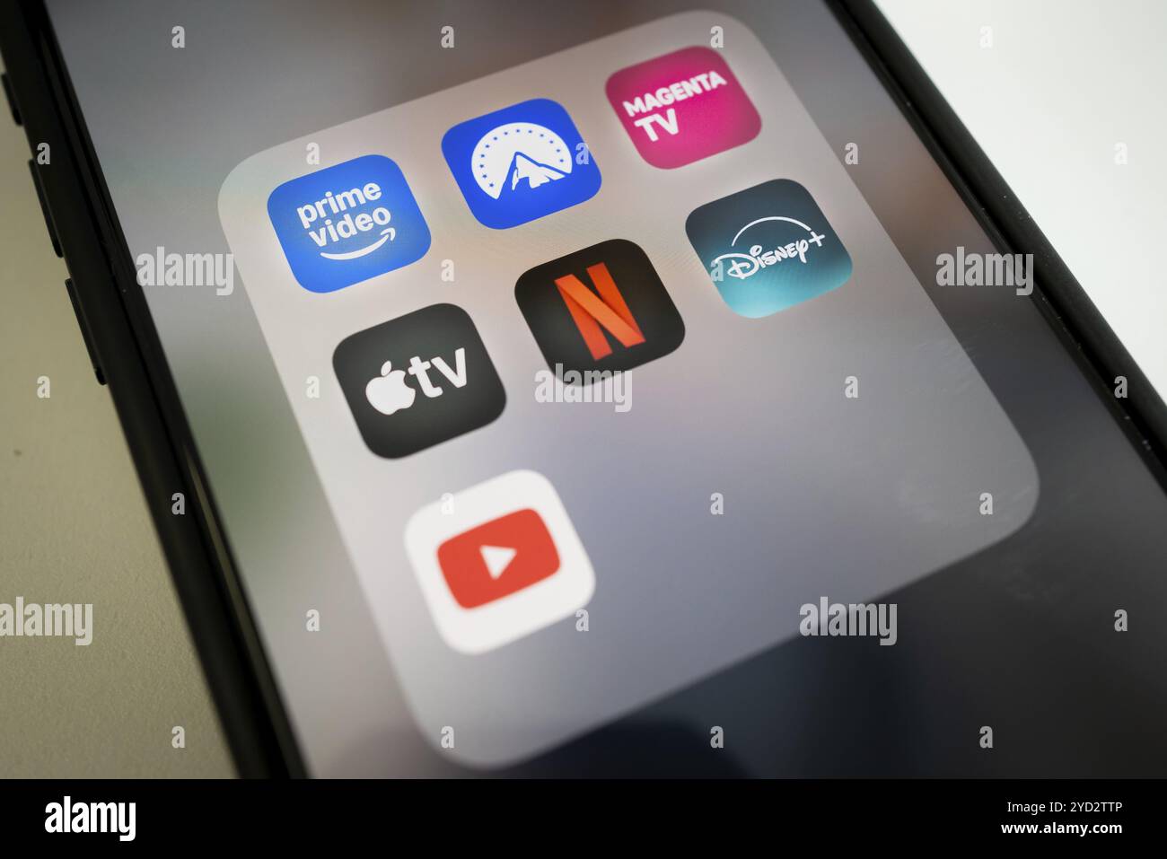 Streaming app icons on smartphone screen, including Netflix, AppleTV ...