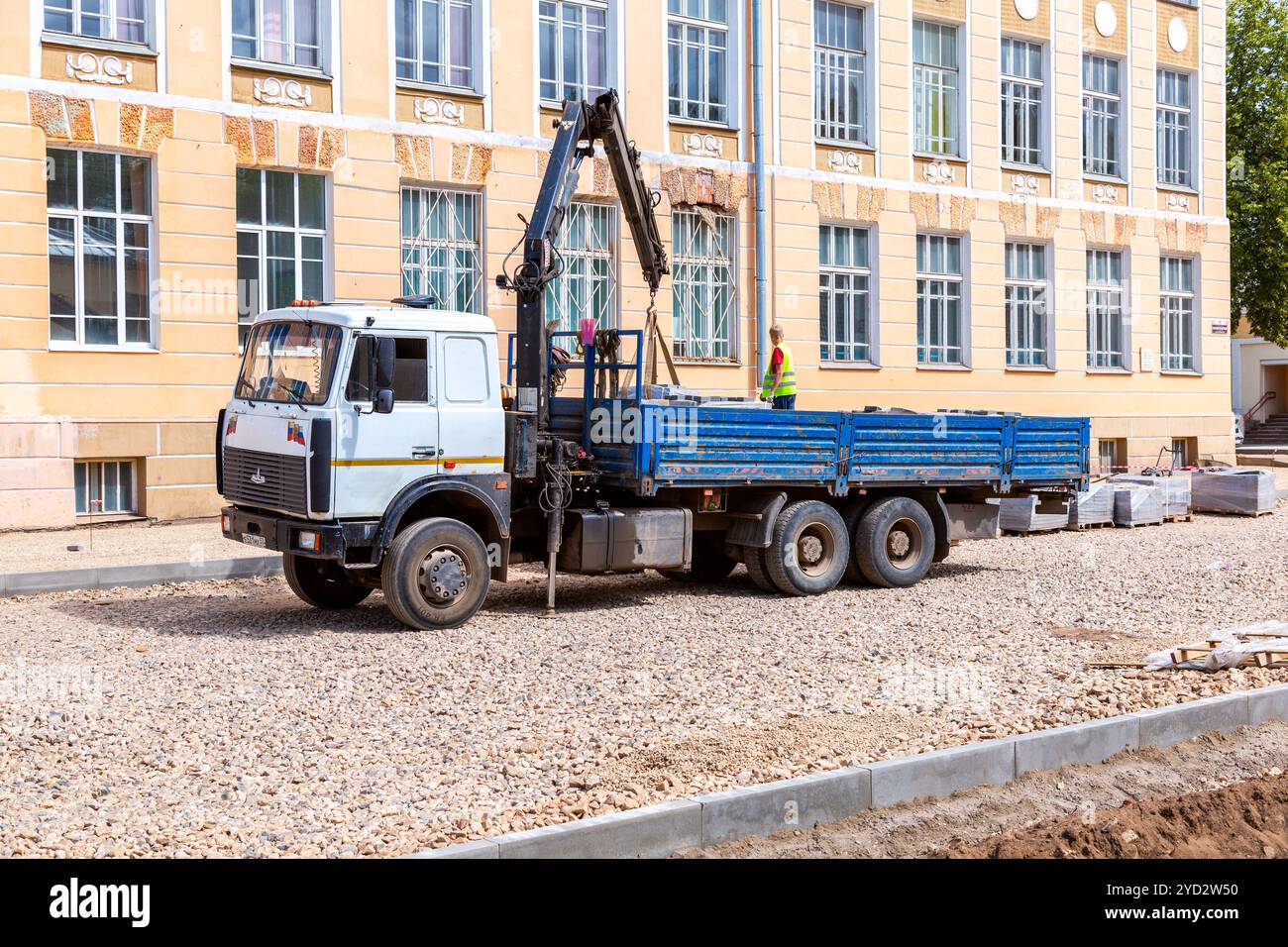 Delivery and unloading of construction materials Stock Photo - Alamy