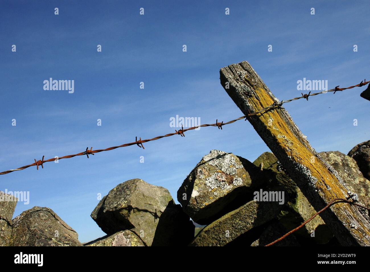 Agriculture Image Of Dry Stone Wall And Barbed Wire Stock Photo - Alamy