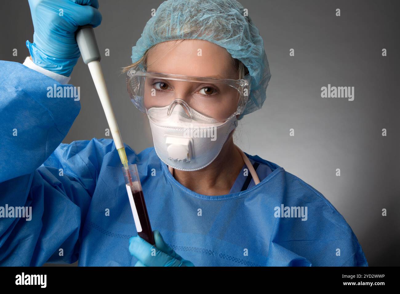 Laboratory pathologist pipetting a patient blood sample Stock Photo - Alamy