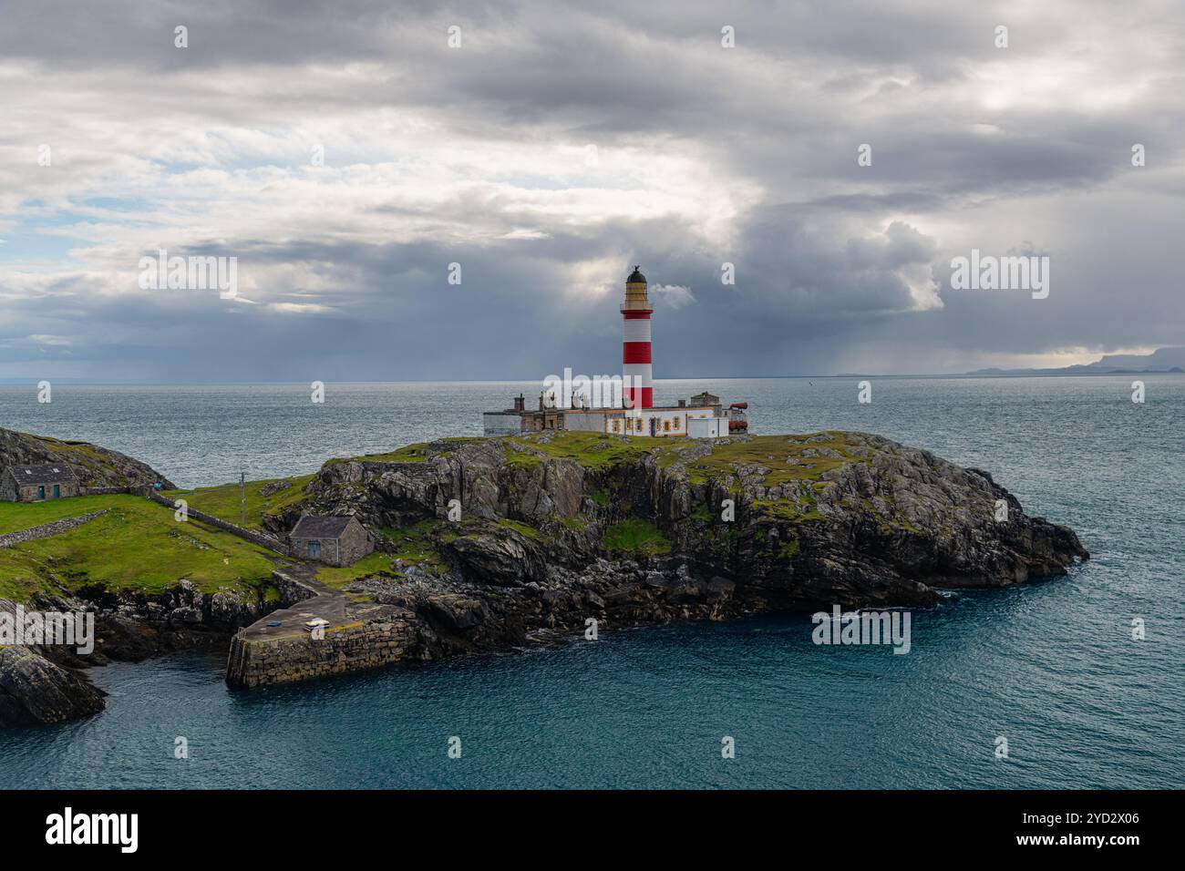 Looking out across the Minch to the Isle of Skye, the red and white ...