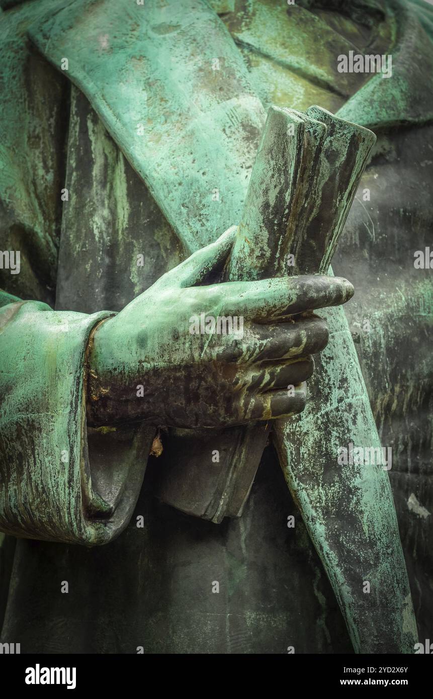Graduation Image Of Old Statue Holding Academic Scroll Stock Photo - Alamy