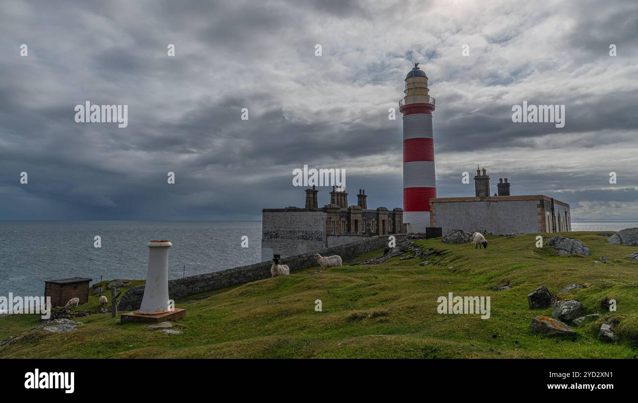 Looking out across the Minch to the Isle of Skye, the red and white ...