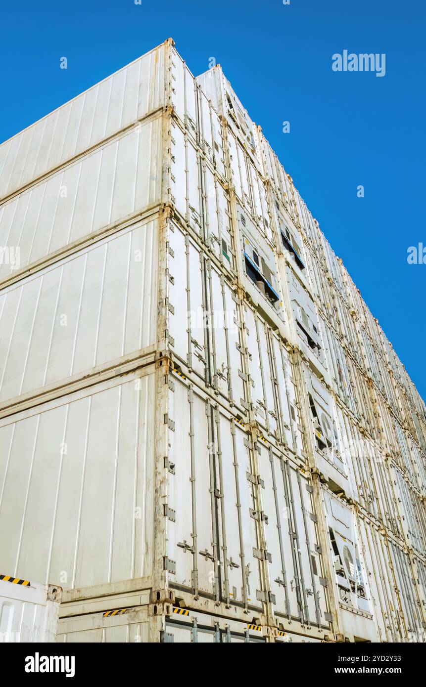 Looking up at a stack of white shipping containers from below Stock ...