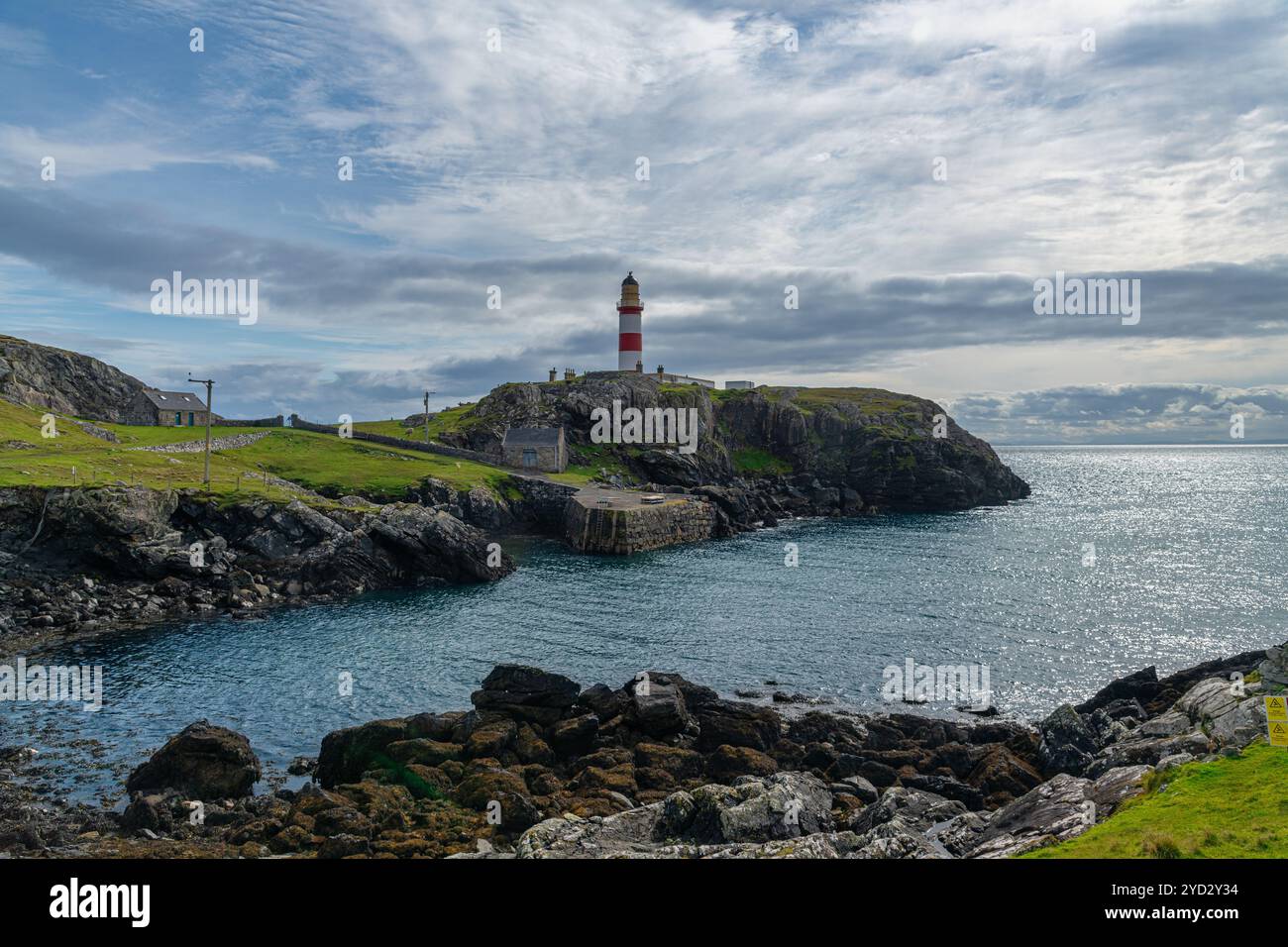 Looking out across the Minch to the Isle of Skye, the red and white ...