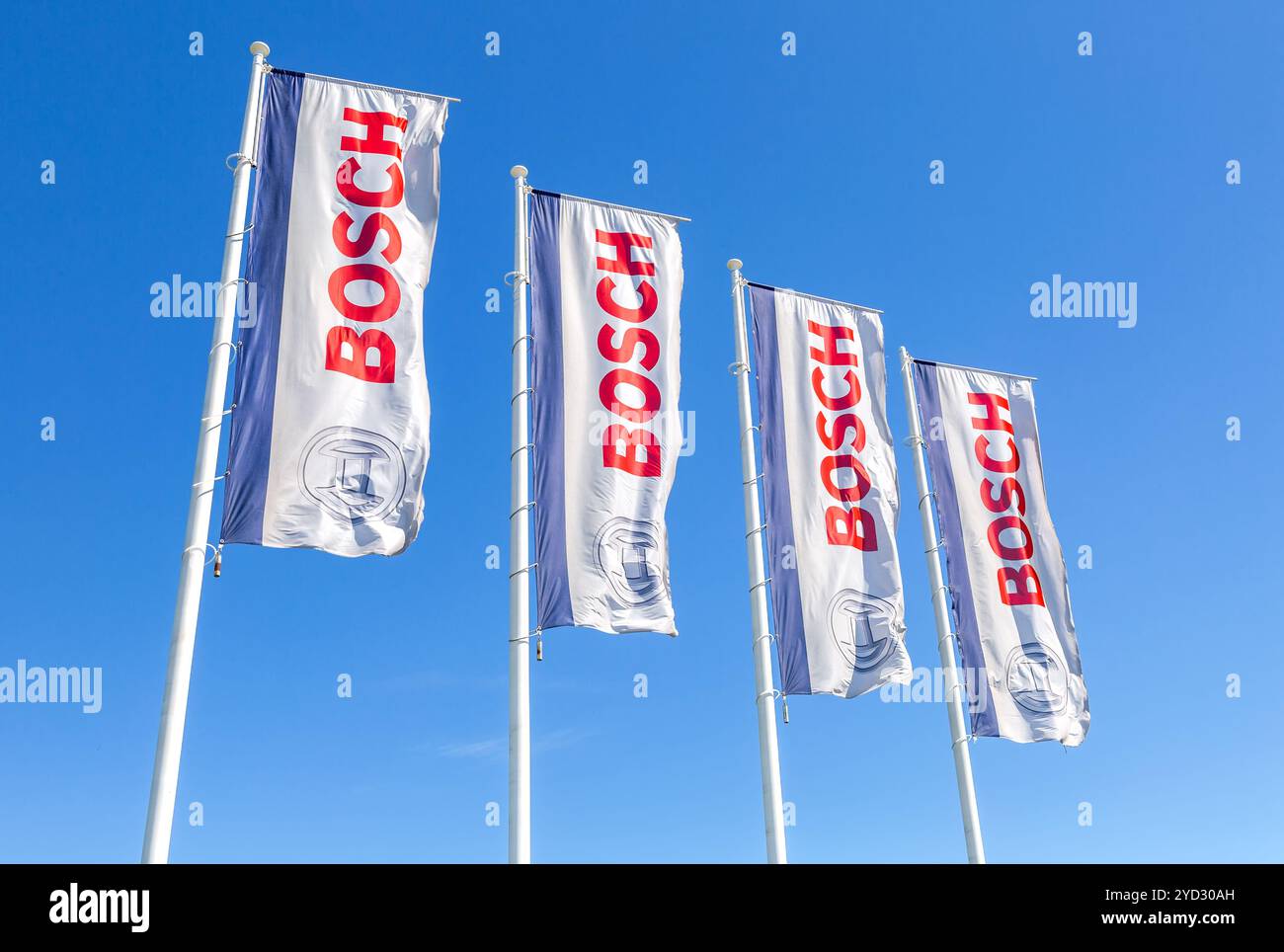 Flags with emblem Bosch against the blue sky Stock Photo - Alamy