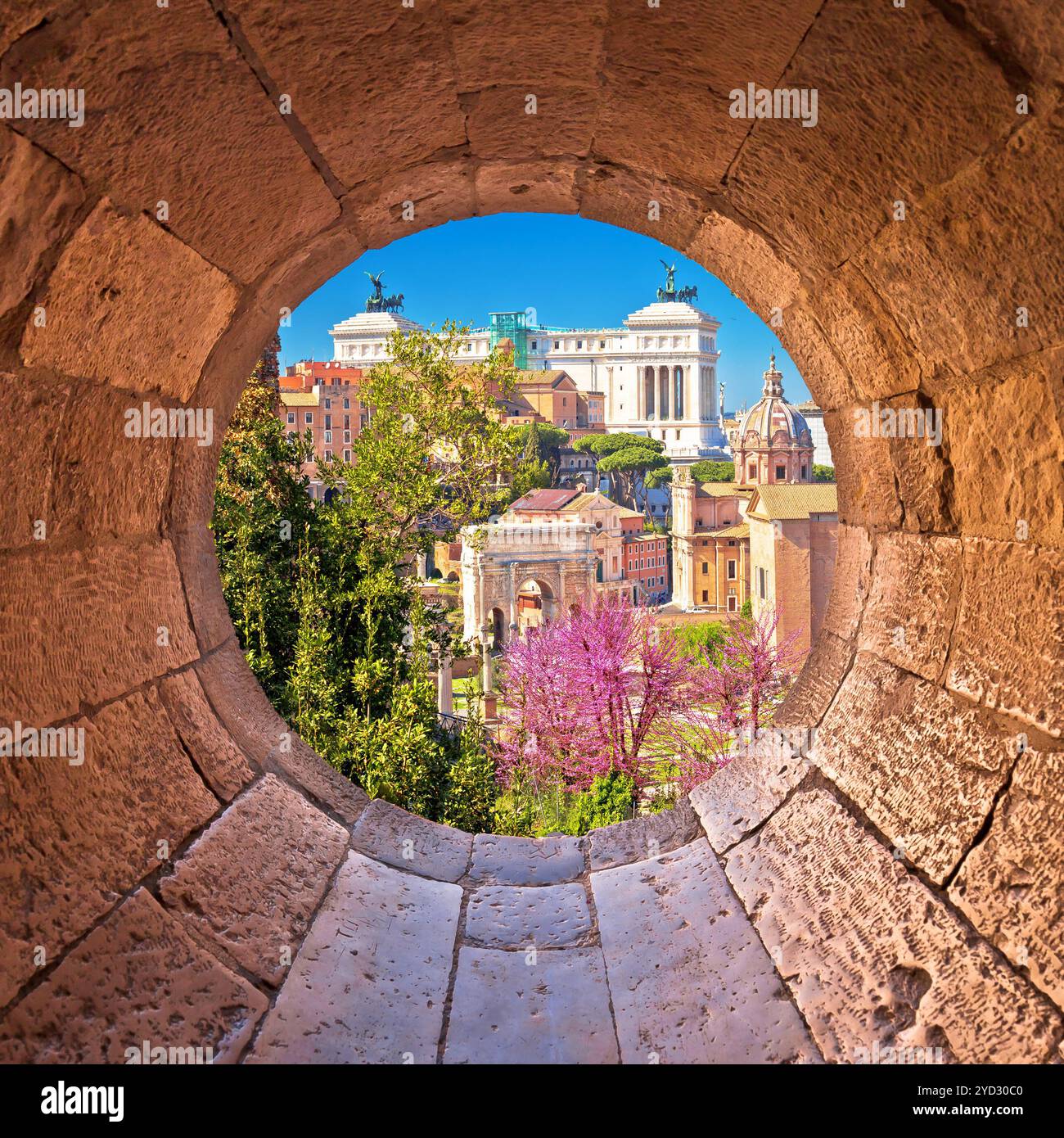 Rome. Scenic springtime view through stone window over the ruins of the ...