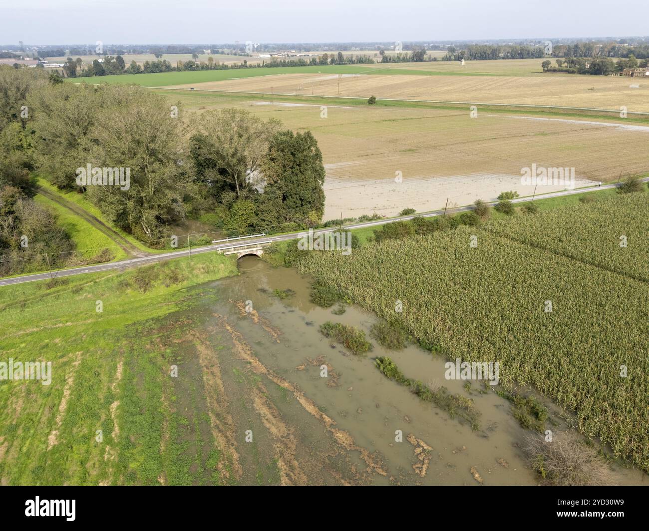 Aerial view of a flooded agricultural landscape with fields and a river ...