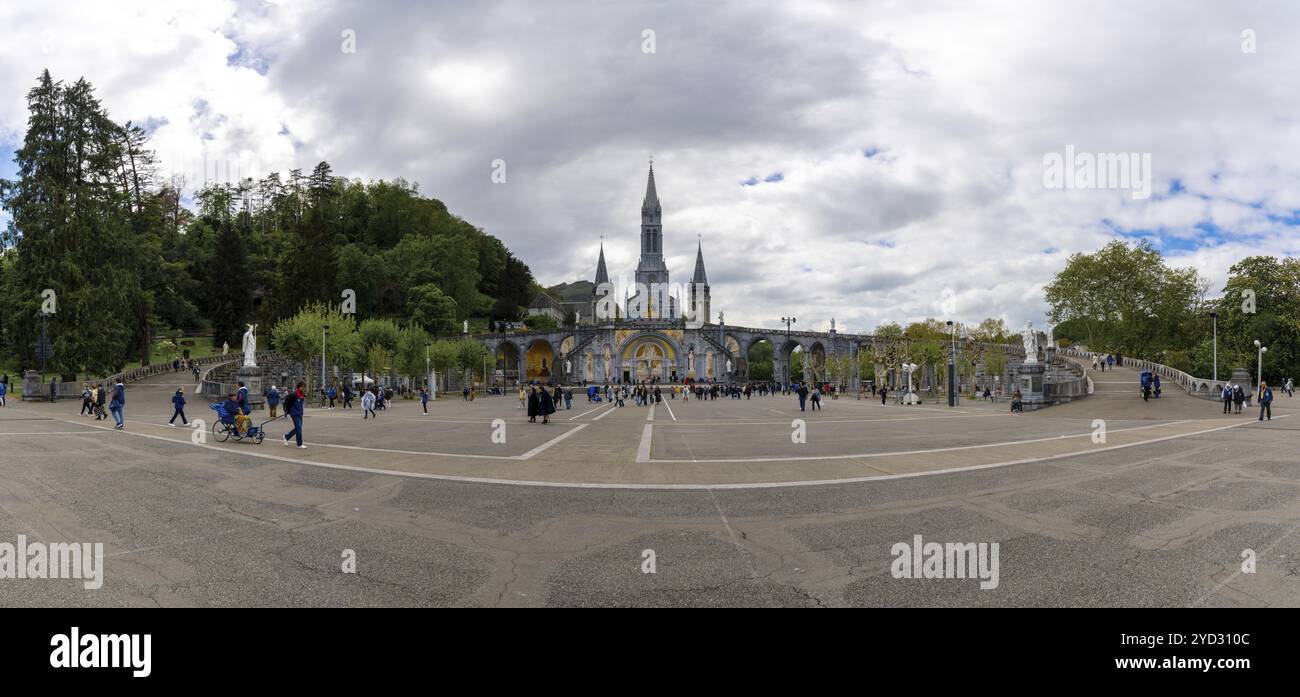 Lourdes, France, 17 April, 2024: many pilgrims visiting the Sanctuary ...