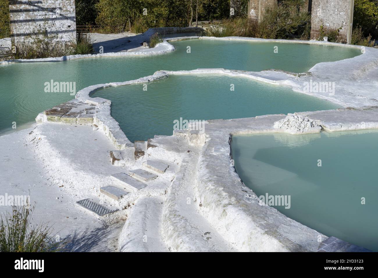 Scenic turquoise hot spring pools in white gypsum baths in Bagni San ...