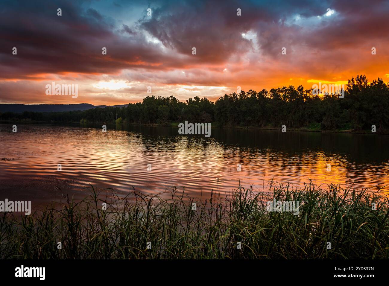 Stormy sunset over water Stock Photo - Alamy