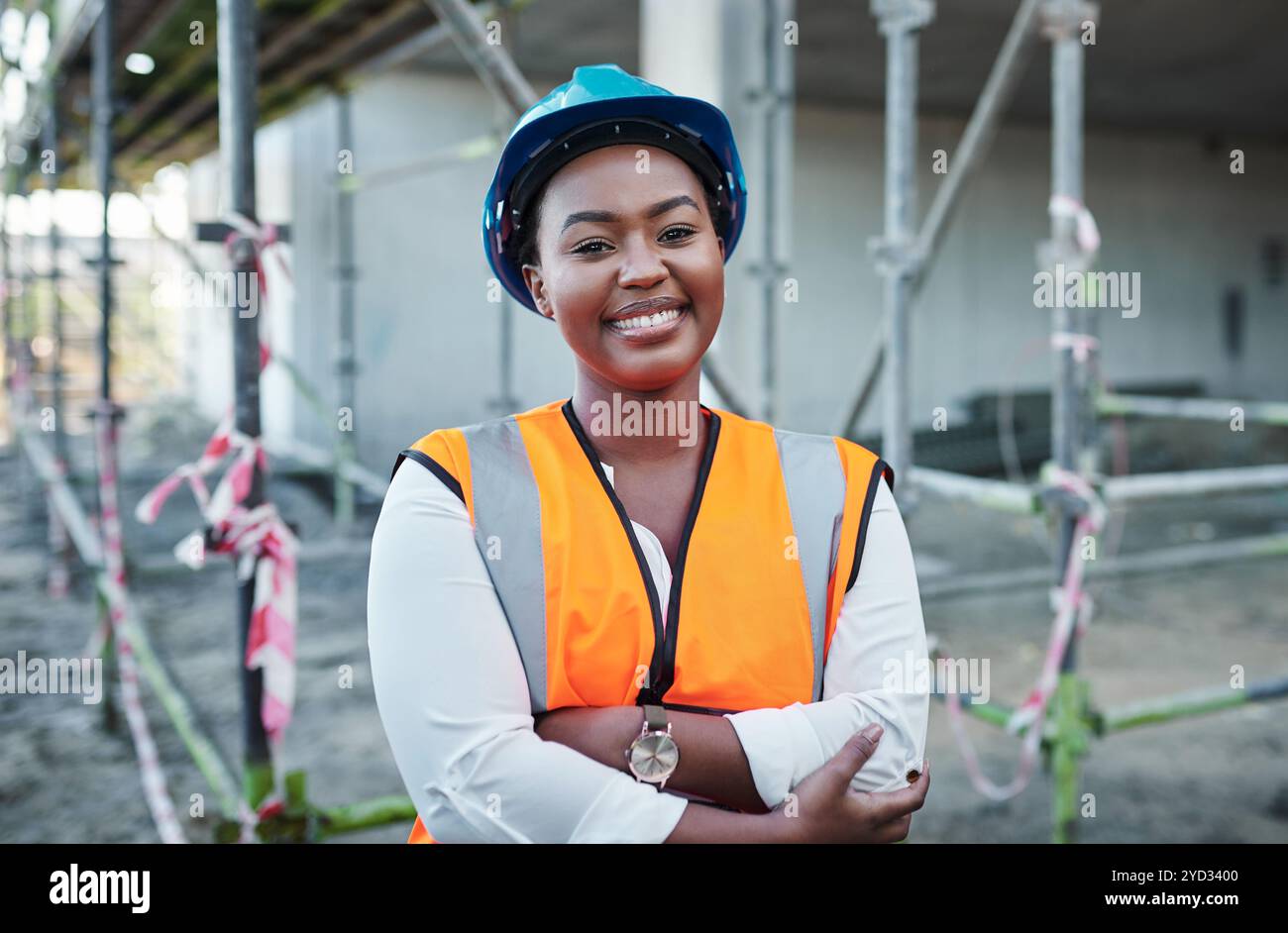 Construction site, architecture and black woman in portrait with arms ...