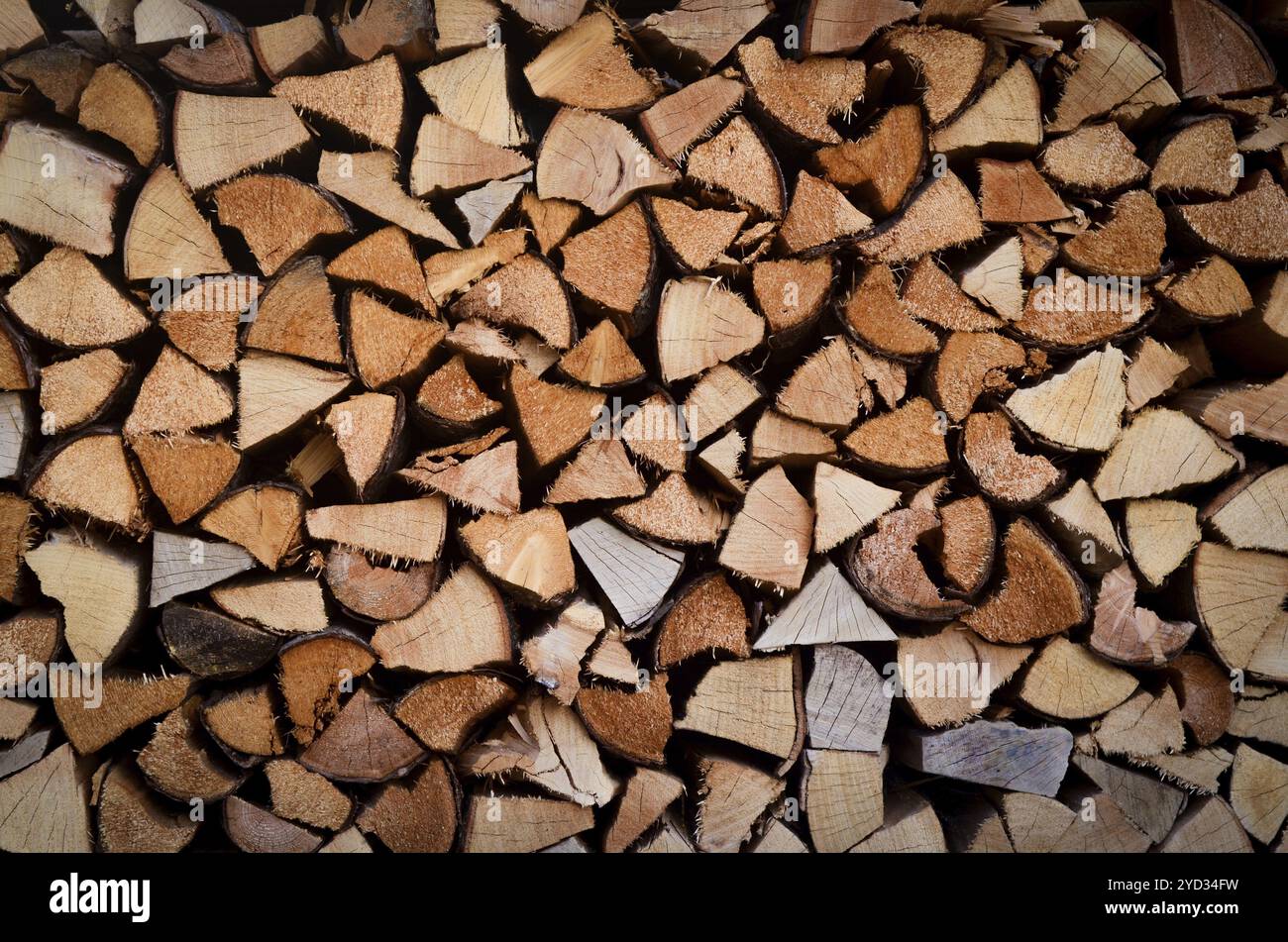 Background Texture Of Stacked Split Wood For Fire Stock Photo - Alamy