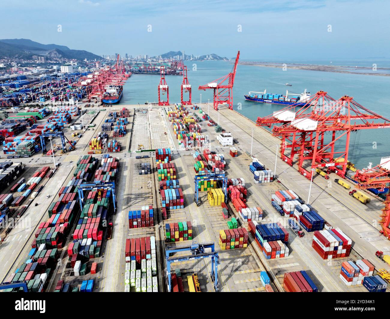 LIANYUNGANG, CHINA - OCTOBER 25, 2024 - Cargo ships load and unload ...