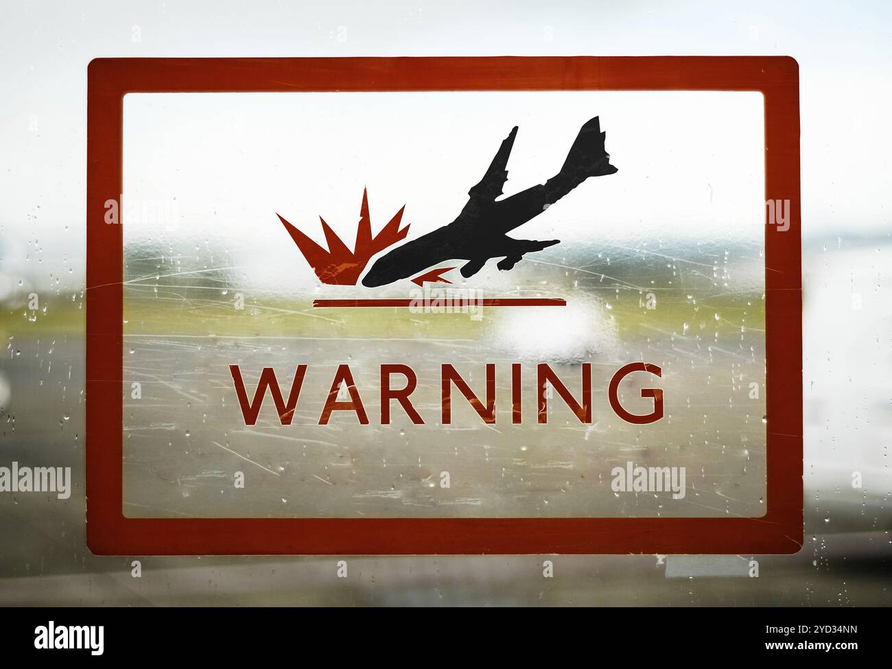A Red Airport Security Warning Sign WIth Crashing Plane Stock Photo - Alamy