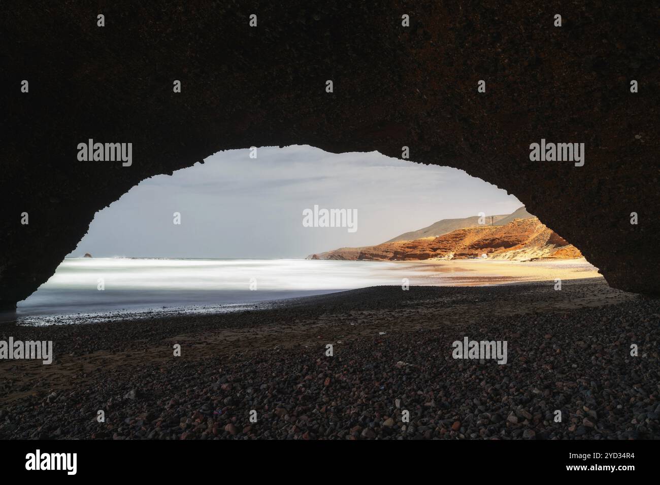 A view of the beach and rock arch at Legzira on the Atlantic Coast of ...