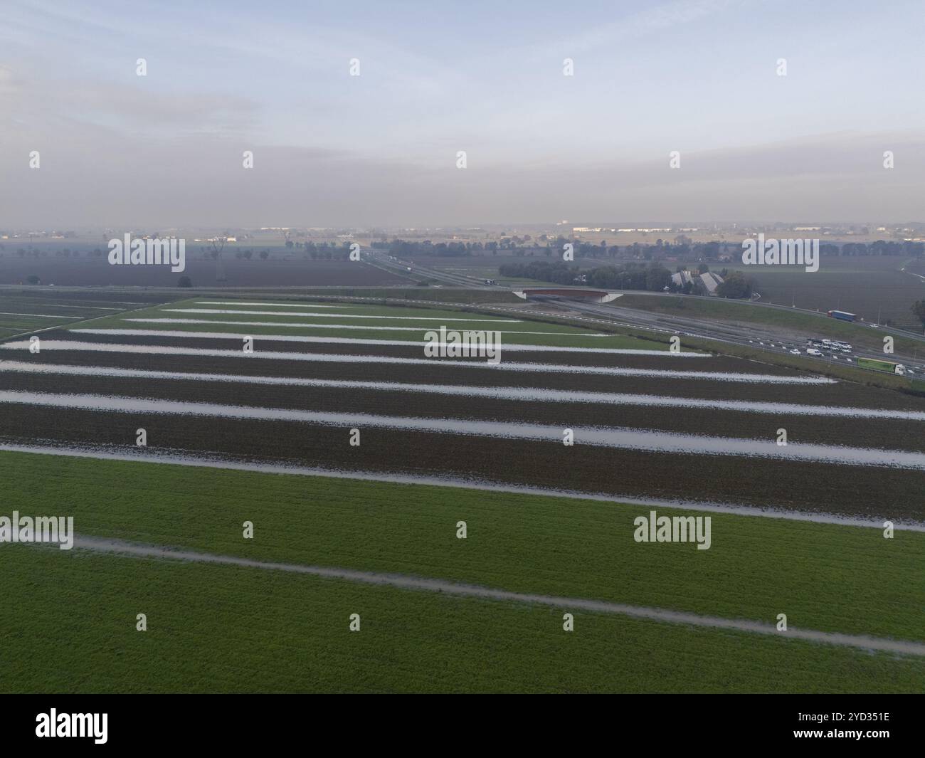 Aerial view of a road crossing the italian countryside after heavy rain ...