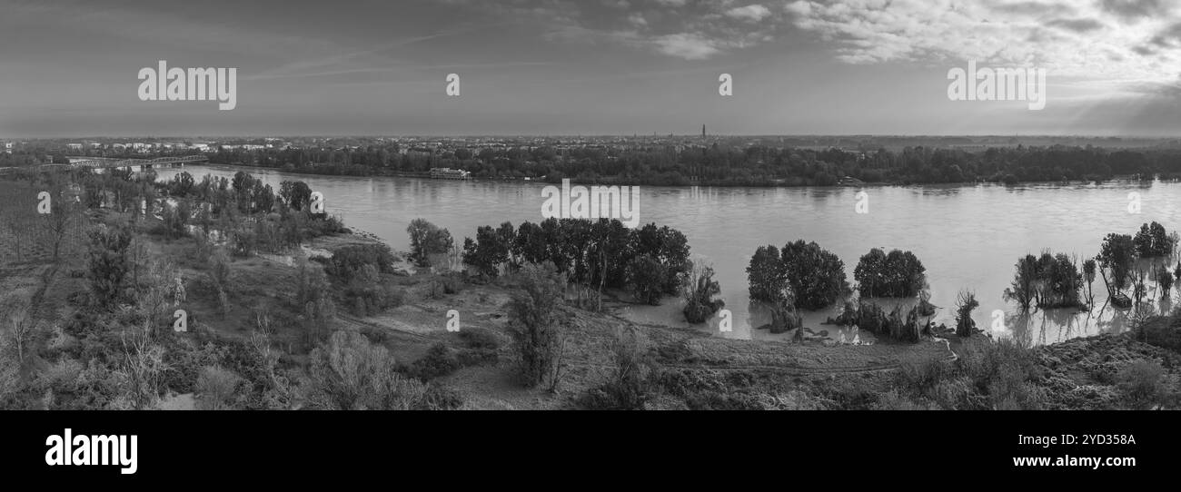 Cremona, Italy, October 20th 2024 Aerial view of a river overflowing its banks, flooding the ...