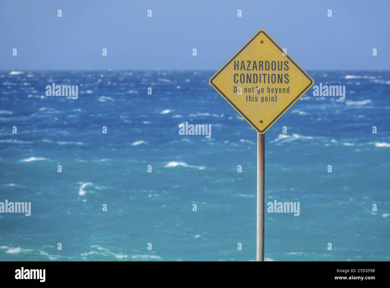A Sign Beside The Ocean In Hawaii Warning Of Hazardous Conditions Stock ...