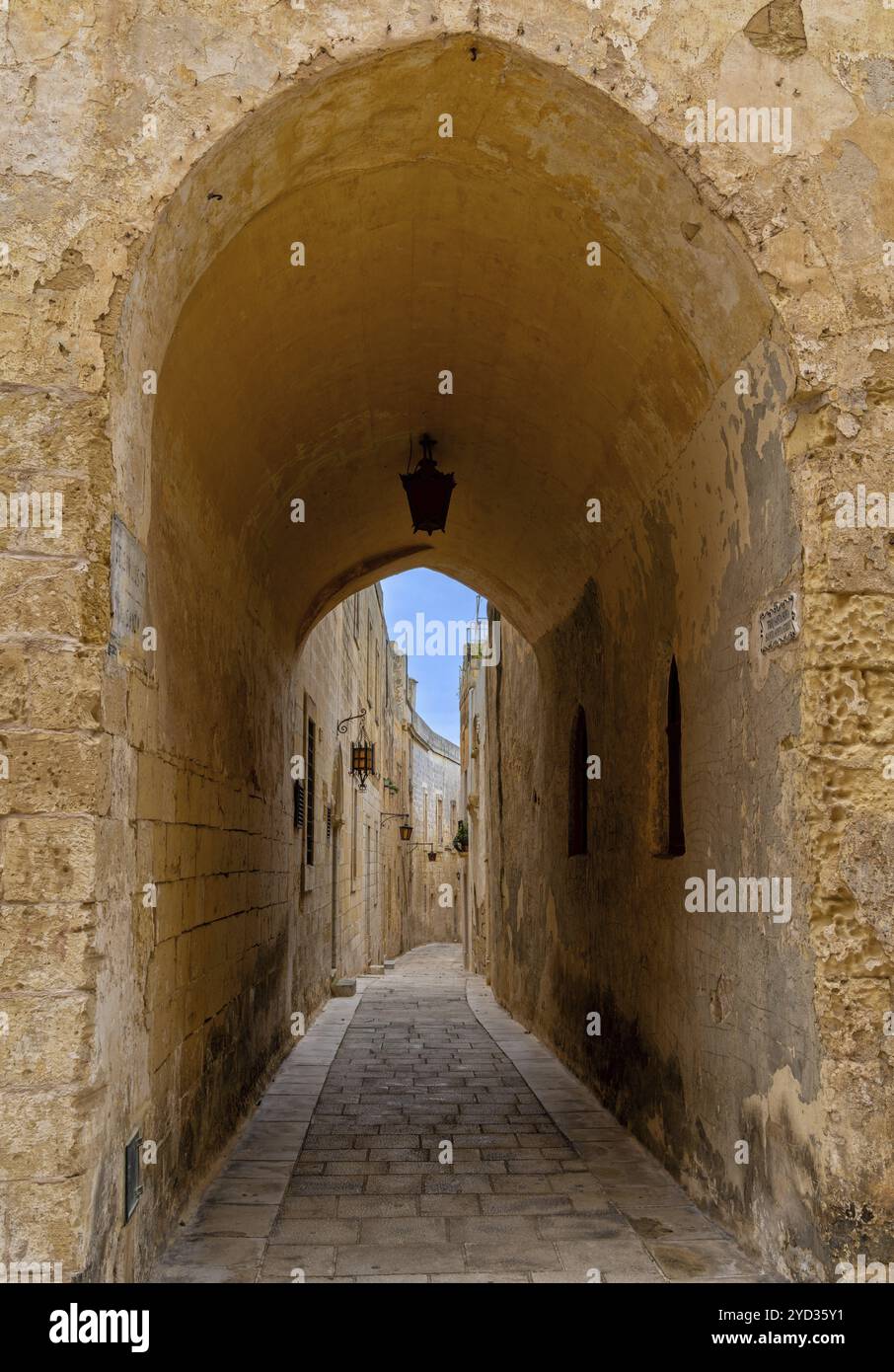 Mdina, Malta, 22 December, 2023:gate leading into a narrow alley in the ...