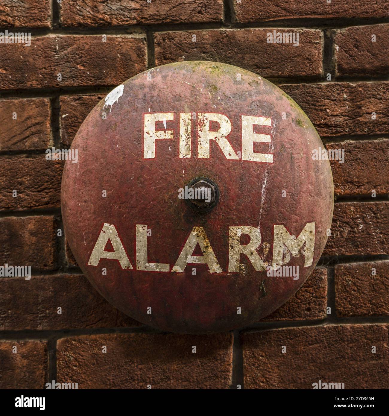 Rustic Vintage Fire Alarm Bell Against A Red Brick Wall Stock Photo - Alamy