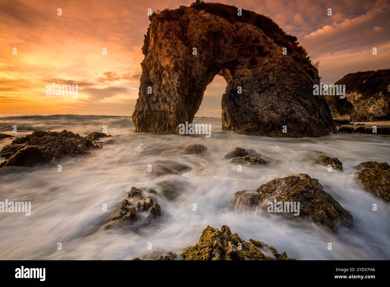 Choppy sea and a magnificent sunrise at Horsehead Rock Australia Stock ...