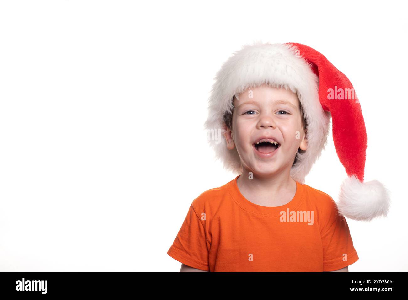 The boy in the Santa hat is laughing . The boy with no teeth laughs ...