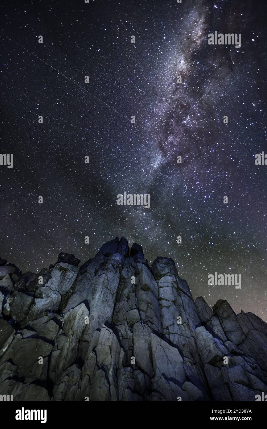 Views of night sky from tall rocky cliffs Stock Photo - Alamy