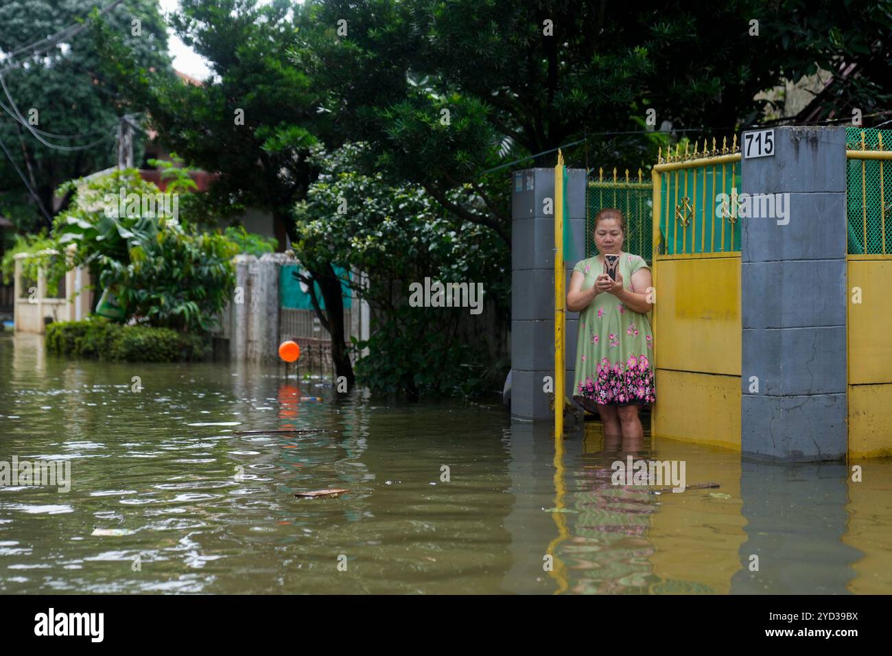 A resident takes pictures of floods caused by Tropical Storm Trami from ...