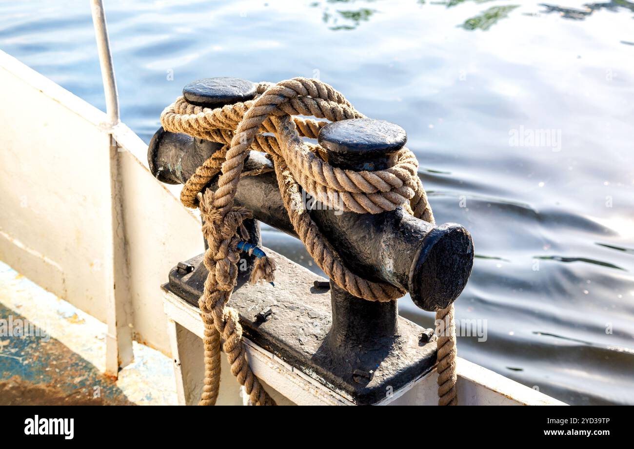 Mooring bollard with a fixed rope on the ship Stock Photo - Alamy