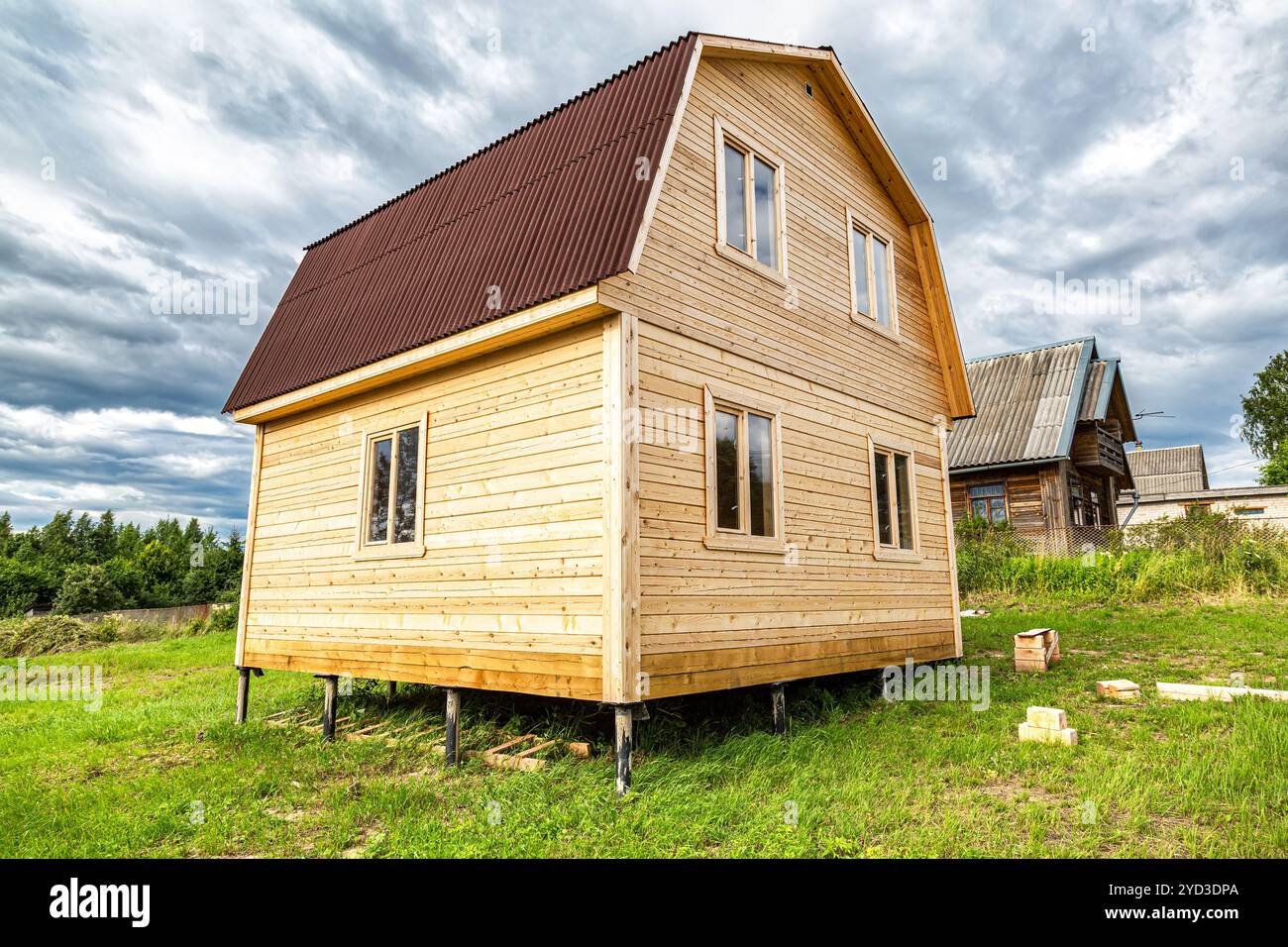 New small wooden house under construction at the village Stock Photo ...