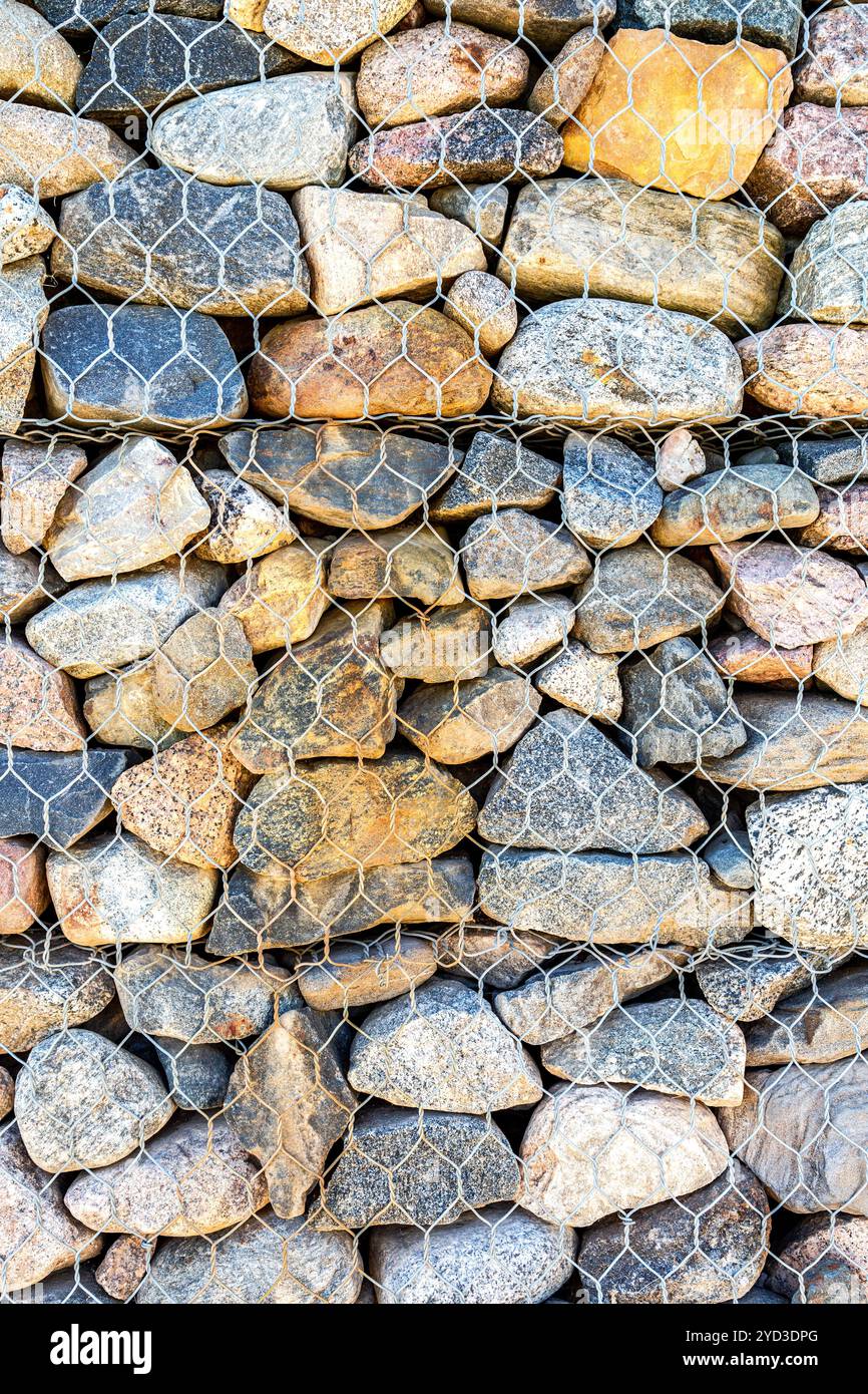 Stone wall with metal grid as background Stock Photo - Alamy