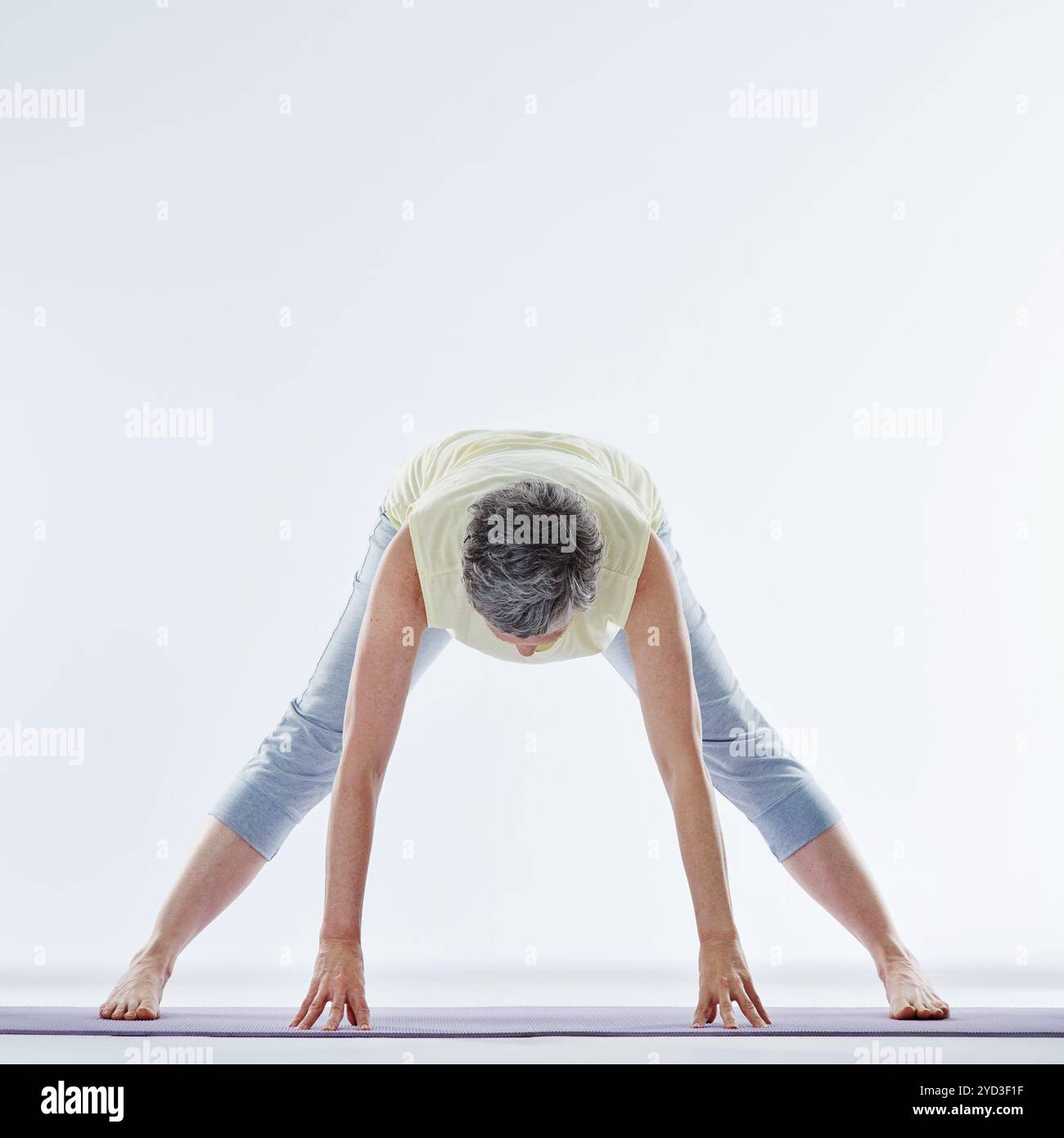 Mature woman, stretching and yoga with workout on mat for zen or ...