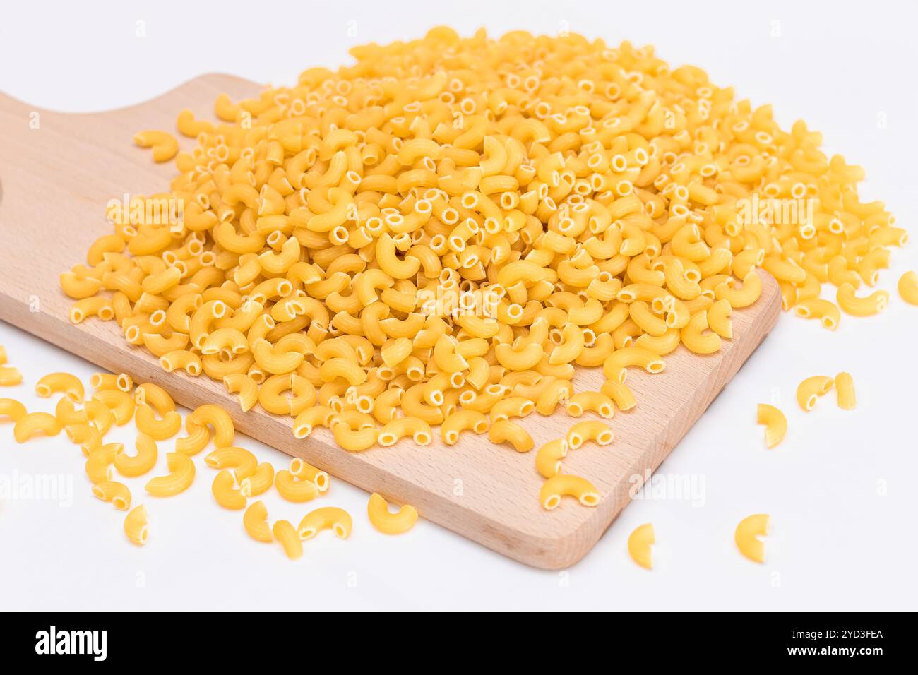 A Heap of Uncooked Chifferi Rigati Pasta on Wooden Kitchen Board. Fat ...