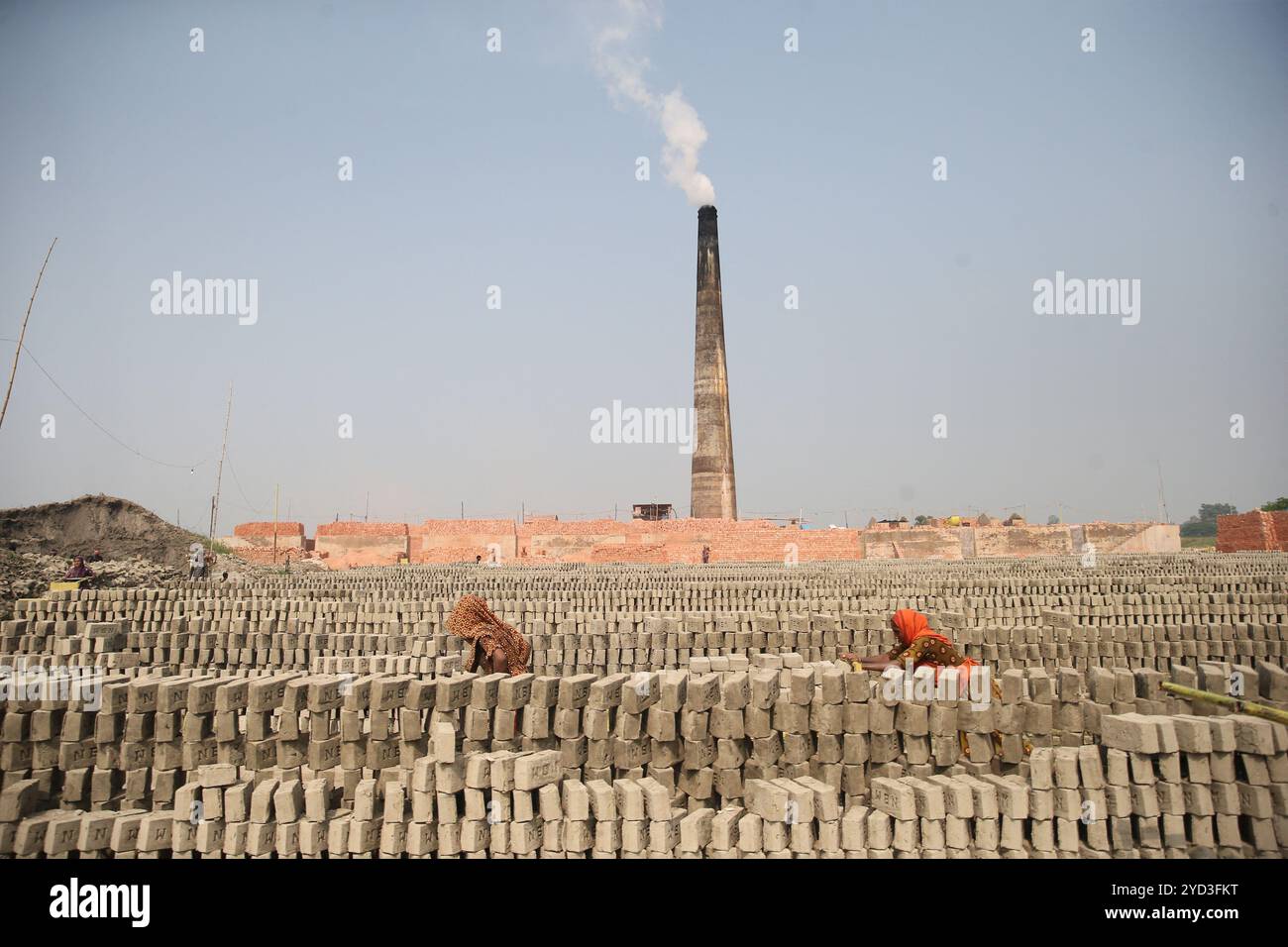 Workers working in a brick field in Dhaka, Bangladesh on October 25 ...