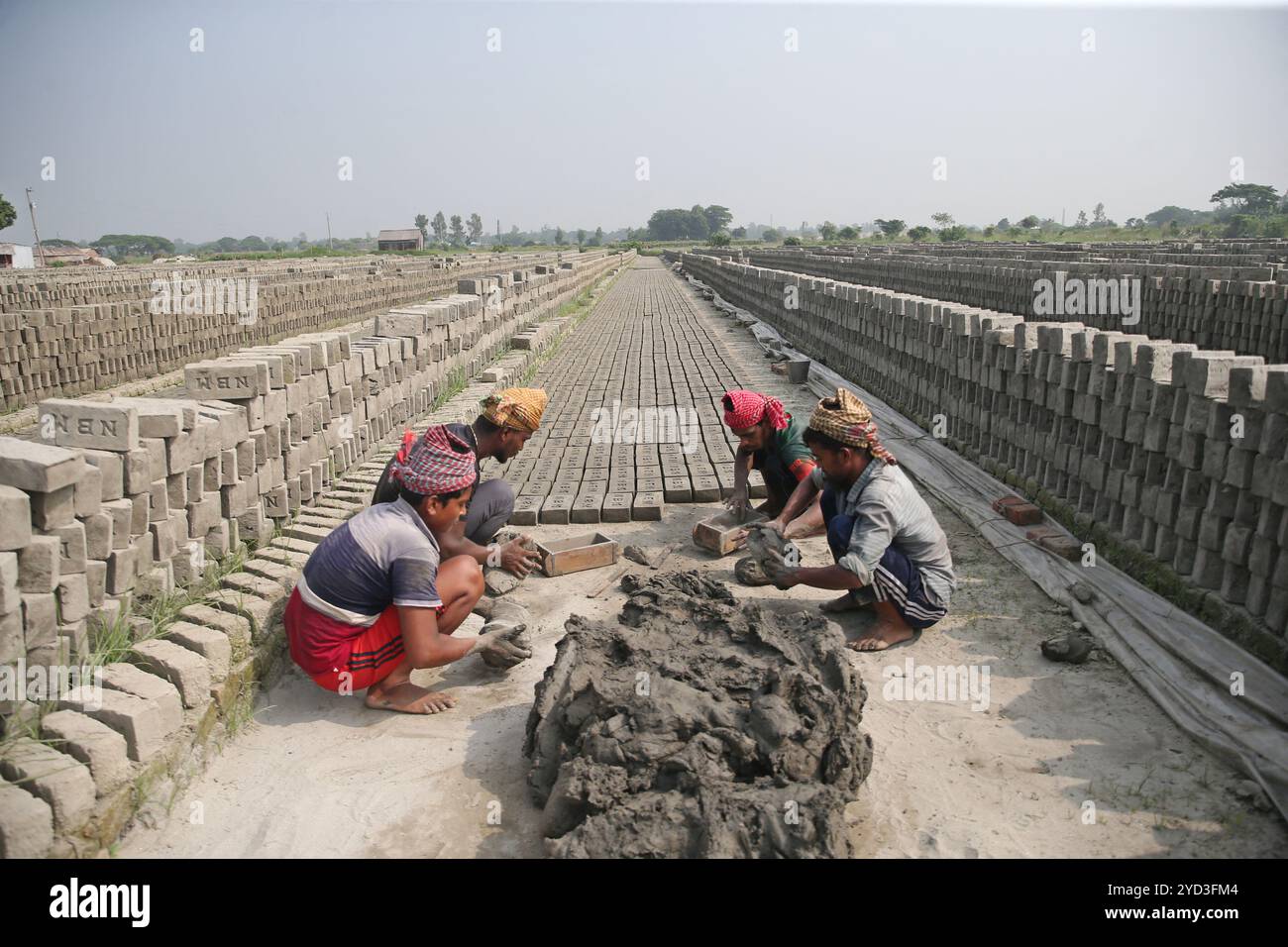 Workers working in a brick field in Dhaka , Bangladesh on October 25 ...