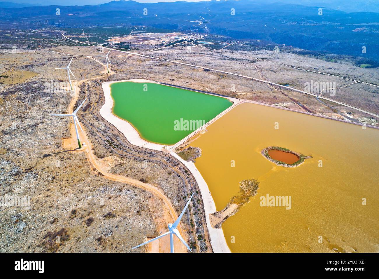 Wind power turbines under Velebit mountain view, Alkaline pool from ...