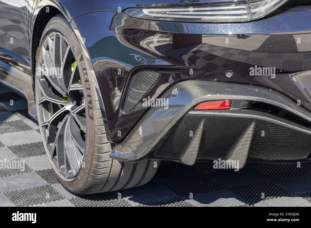 Close up view of the rear bumper of a black aston martin vantage coupe ...