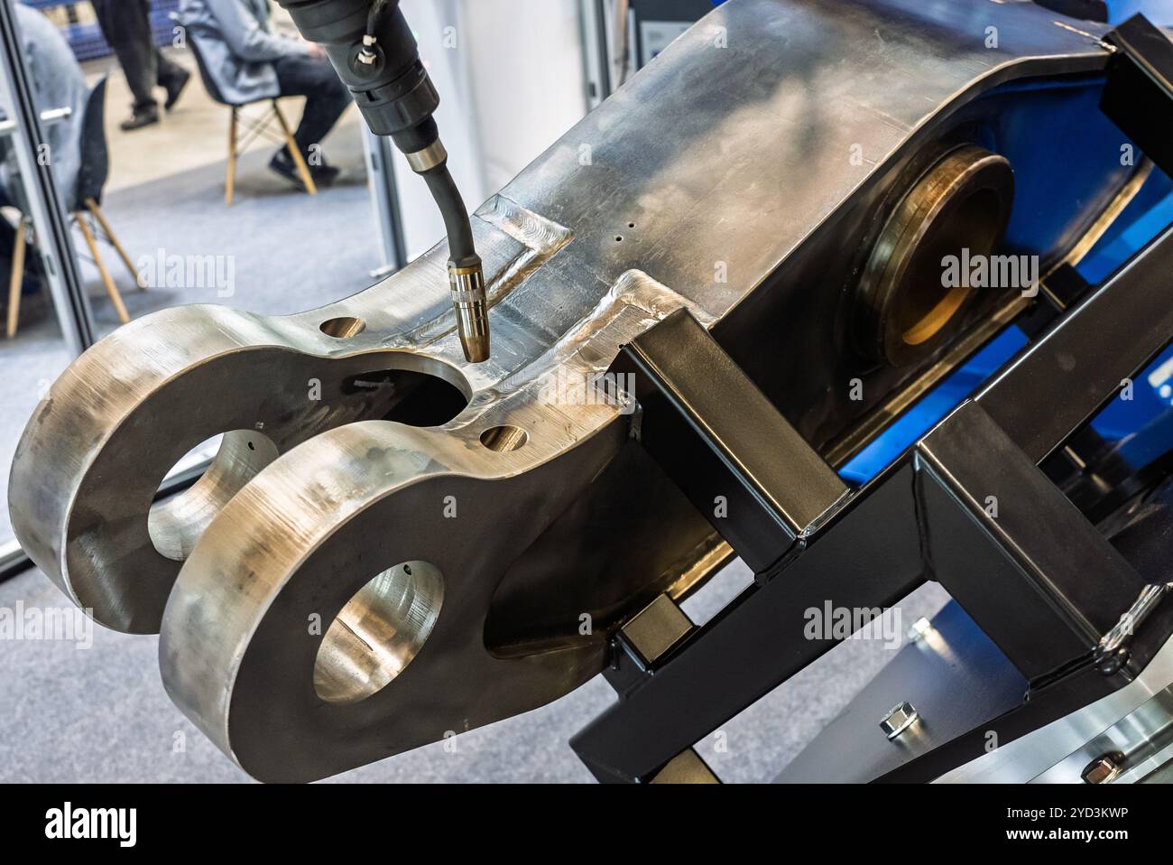 Robot welds steel. Welding head. Welding robot. CNC welding ...