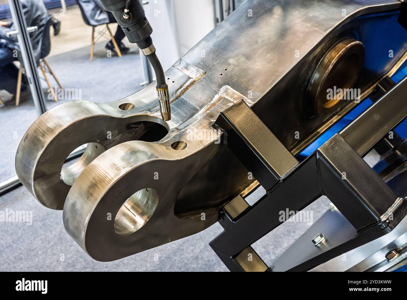 Robot welds steel. Welding head. Welding robot. CNC welding ...