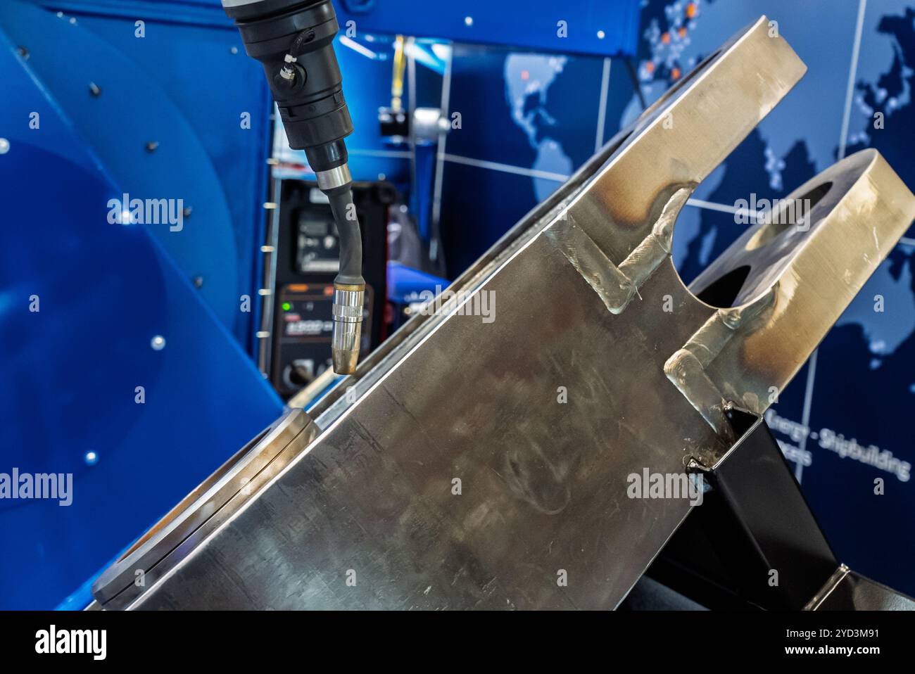 Robot welds steel. Welding head. Welding robot. CNC welding. Robotization and automation of the ...