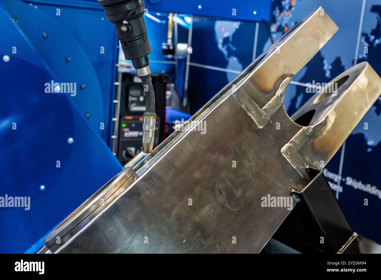 Robot welds steel. Welding head. Welding robot. CNC welding ...