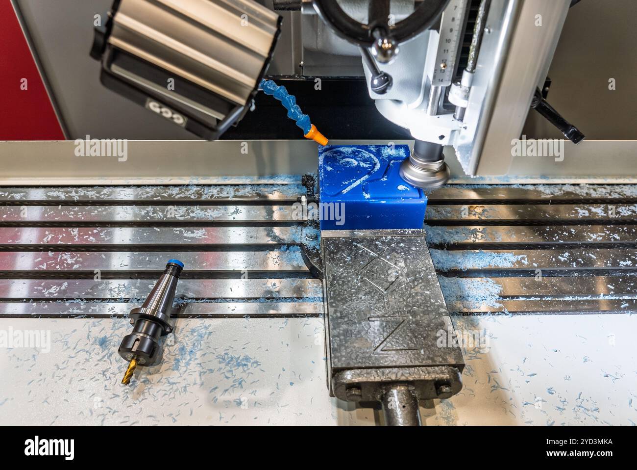 Metalworking CNC lathe milling machine with coolant. Milling a piece of ...