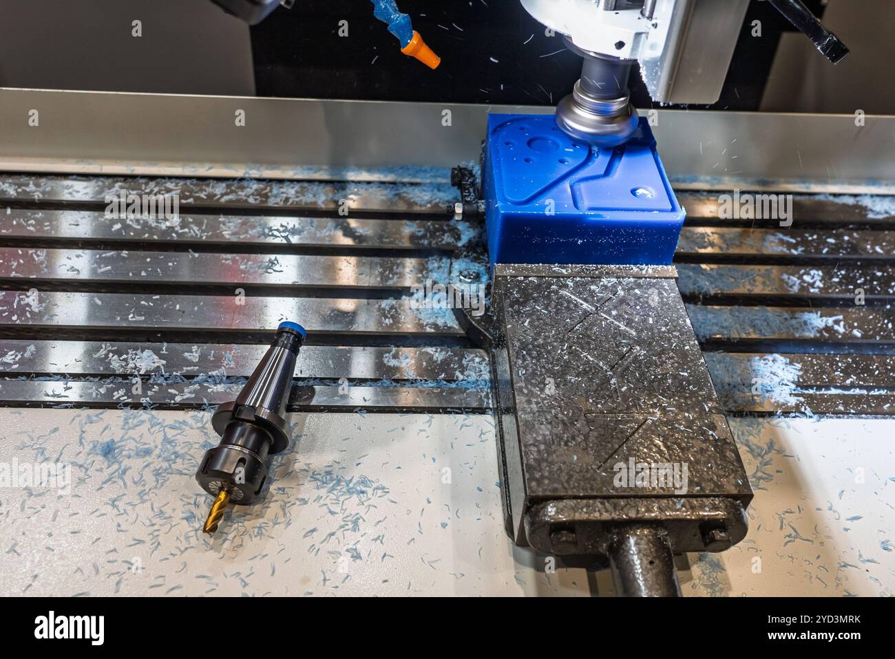 Metalworking CNC lathe milling machine with coolant. Milling a piece of ...